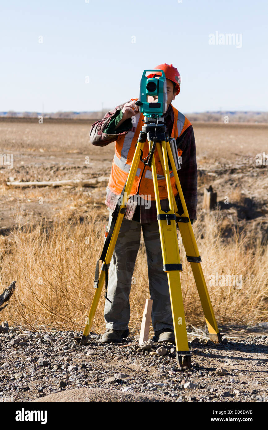 Land surveyors measuring existing railroad bridge in rural area Stock ...