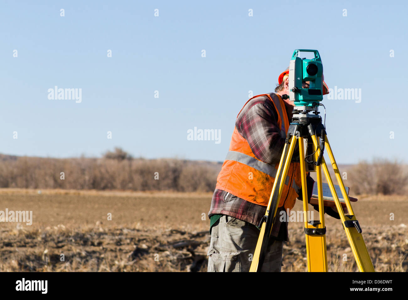 Land surveyors measuring existing railroad bridge in rural area Stock ...