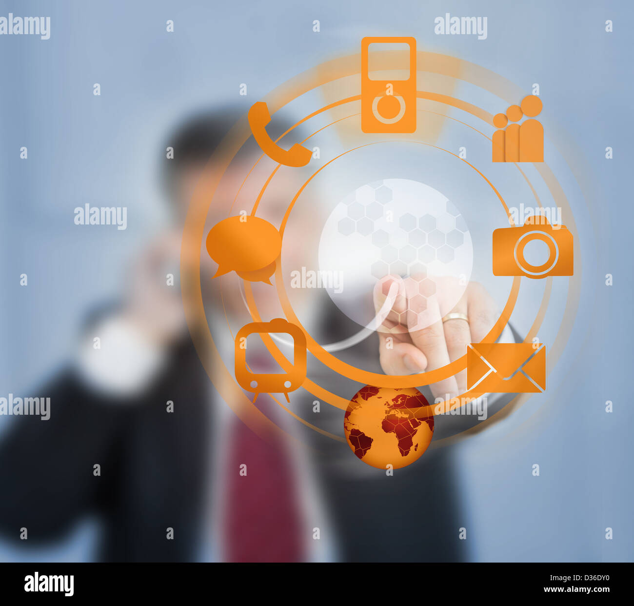 Businessman using orange wheel interface for computer applications ...