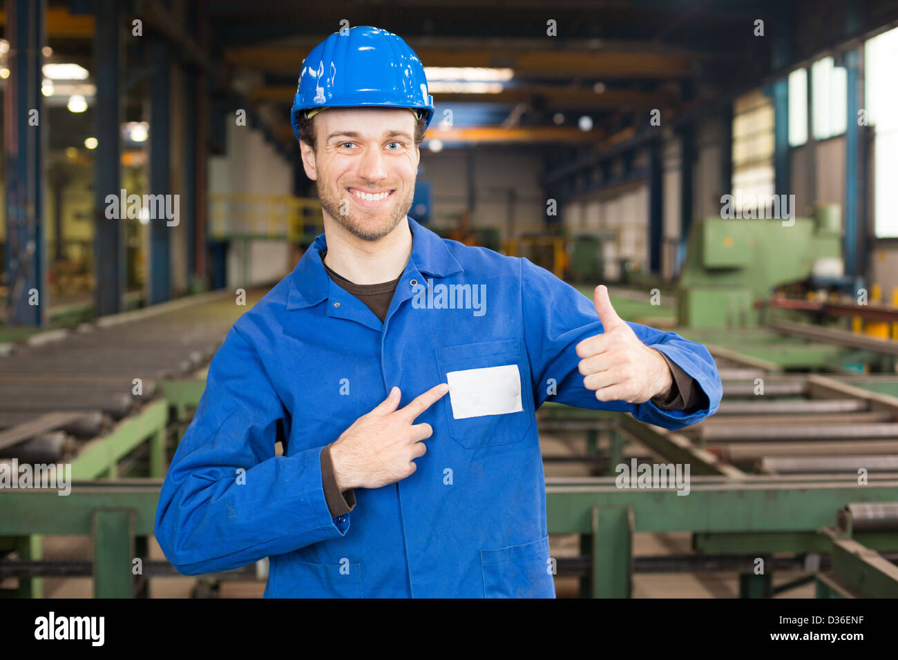 Construction worker with helmet in assembly hall with thumbs up Stock ...