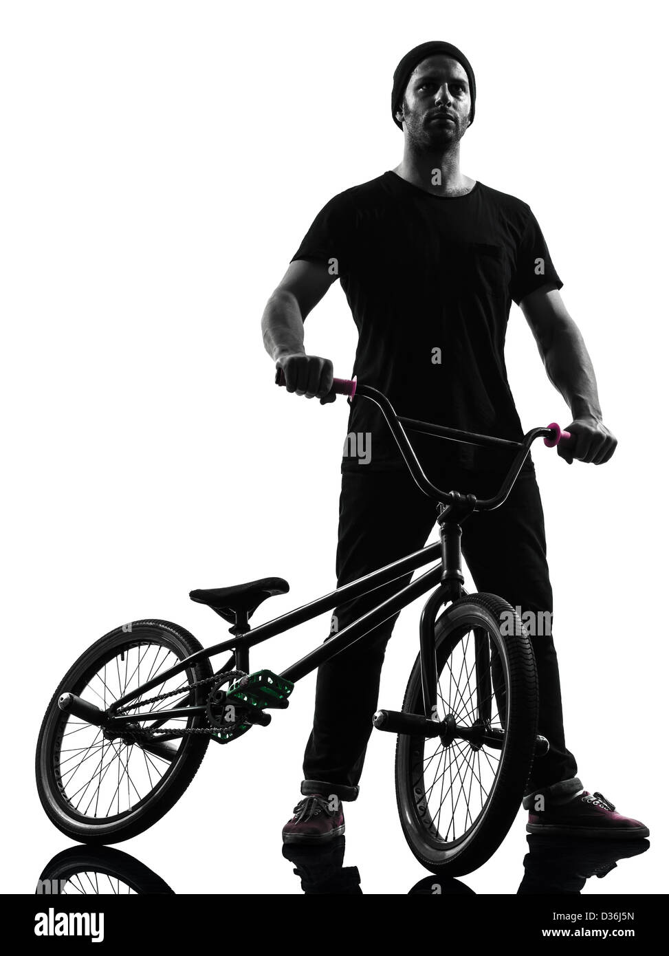 one man exercising bmx acrobatic figure in silhouette studio isolated ...