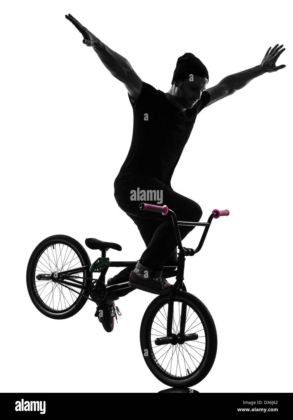 one man exercising bmx acrobatic figure in silhouette studio isolated ...