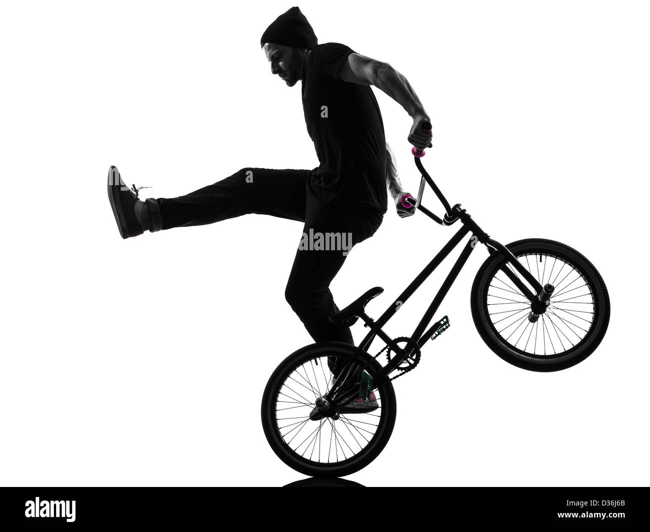 one man exercising bmx acrobatic figure in silhouette studio isolated ...