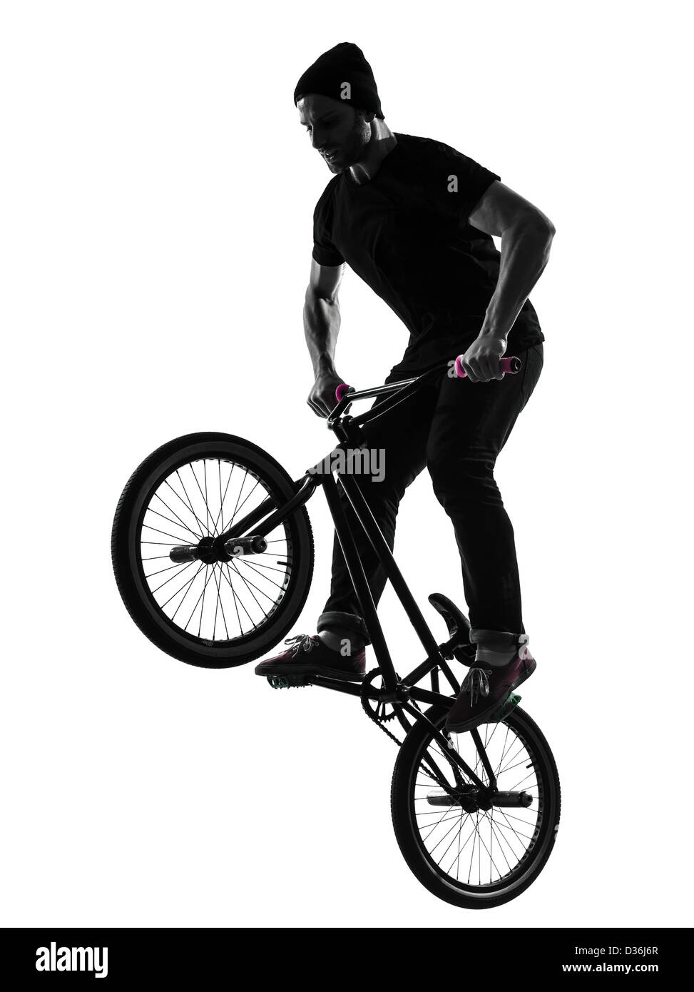 one man exercising bmx acrobatic figure in silhouette studio isolated ...