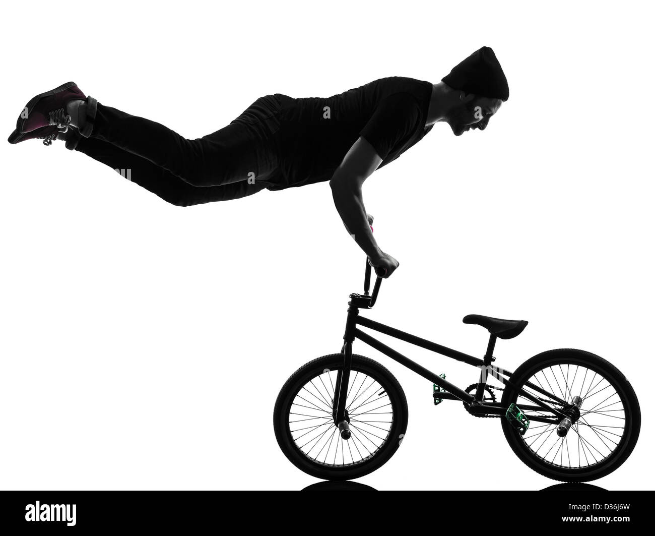 one man exercising bmx acrobatic figure in silhouette studio isolated ...