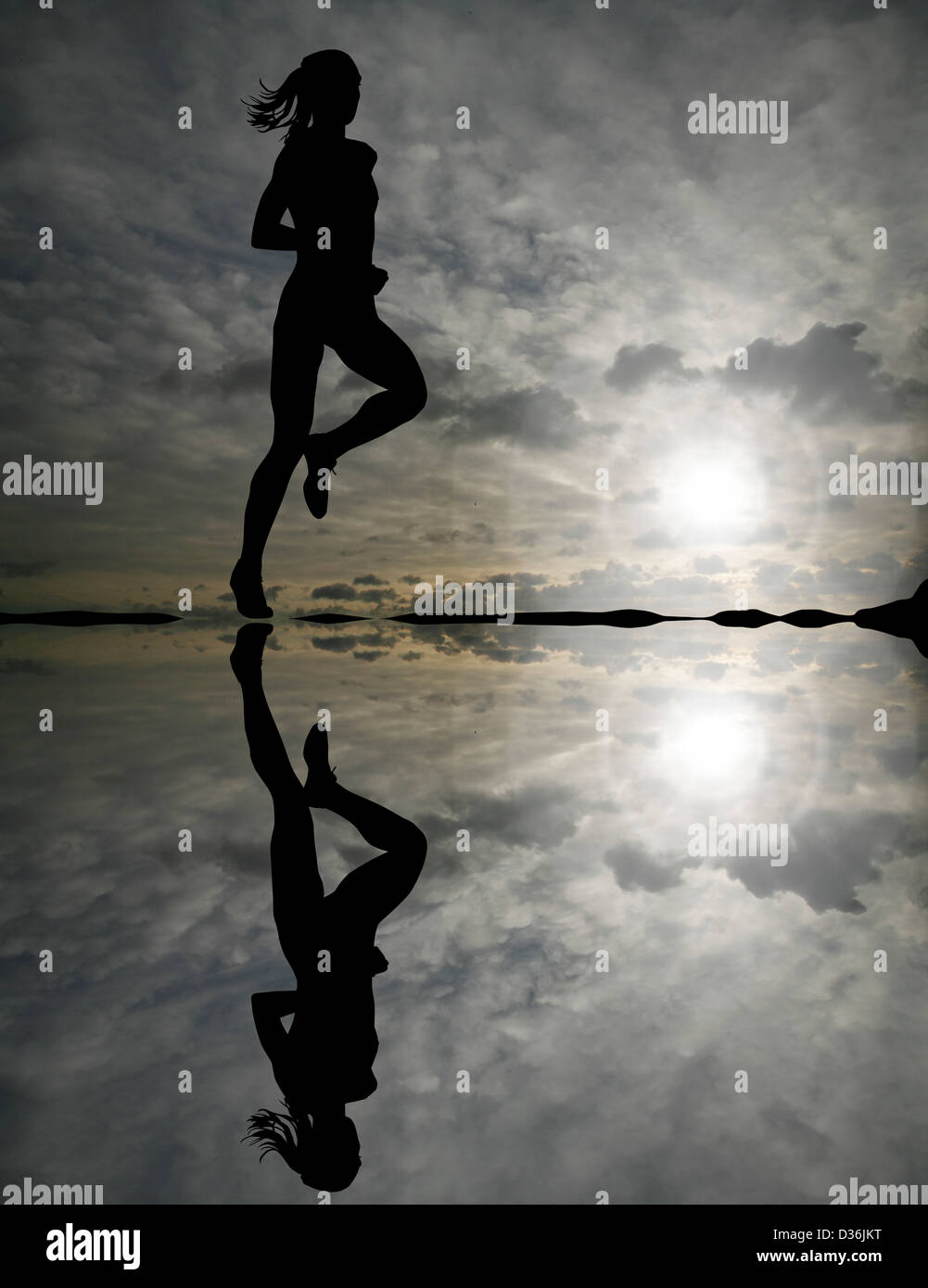 Female runner silhouette against the sunset Stock Photo - Alamy