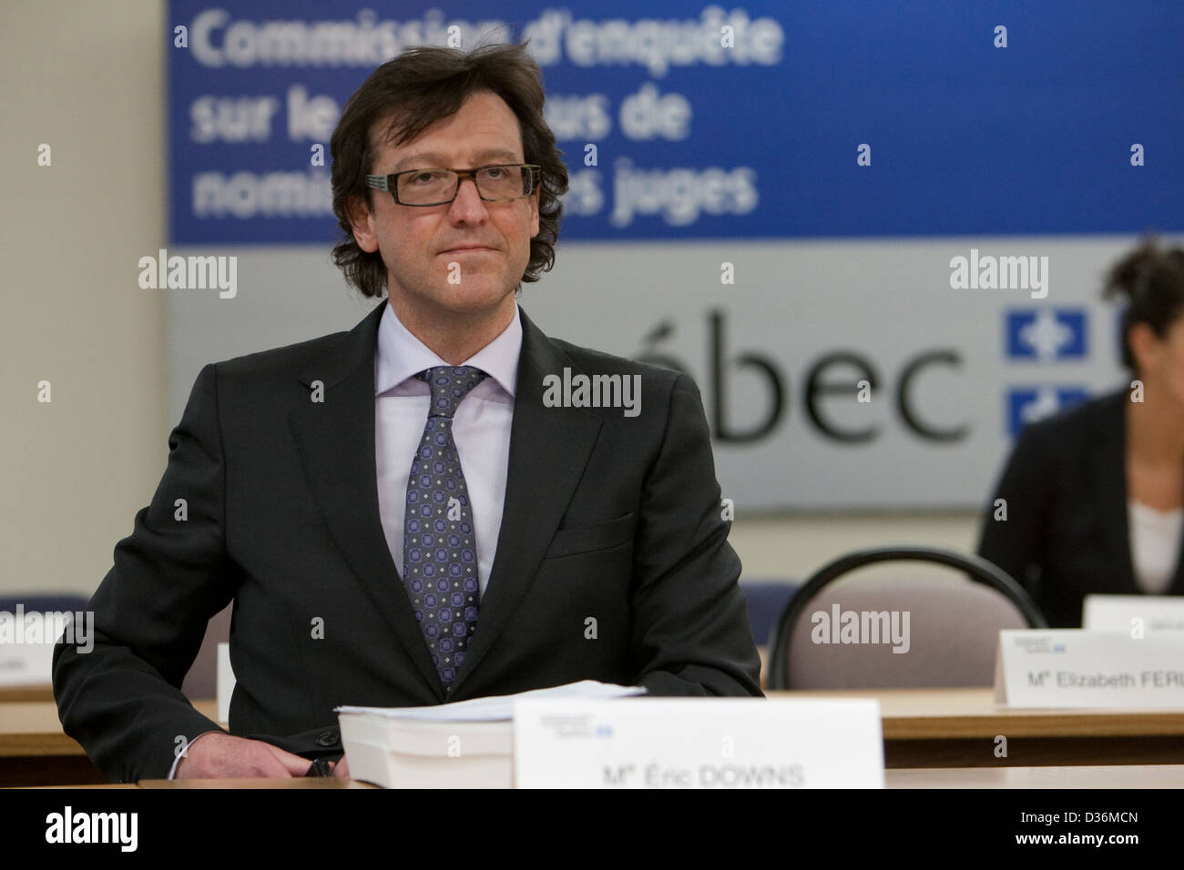 Eric Downs listens as commissioner Michel Bastarache unveils the report of his inquiry in the ...