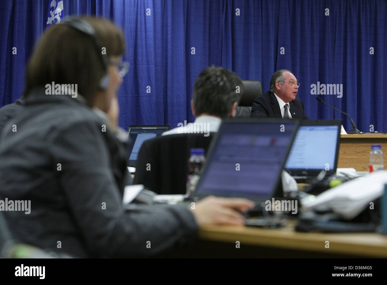 Journalists listen as commissioner Michel Bastarache unveils the report ...
