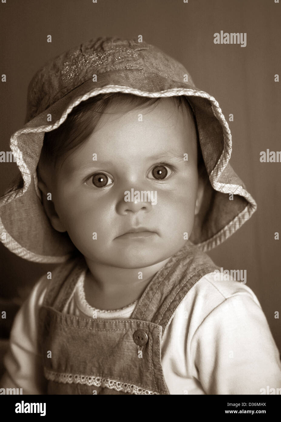 Portrait of the little girl in hat at home Stock Photo - Alamy