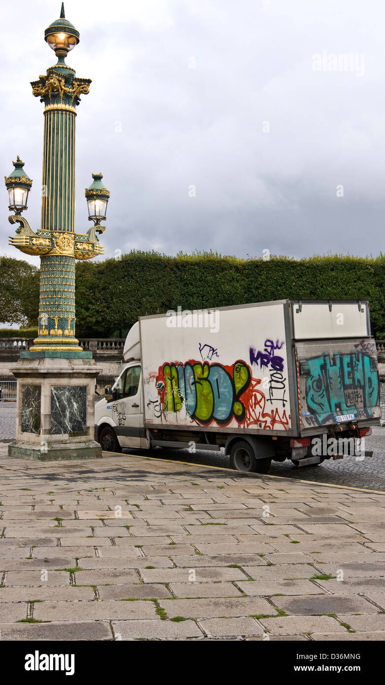 Ornate lamppost street light and graffiti covered van Place de la ...