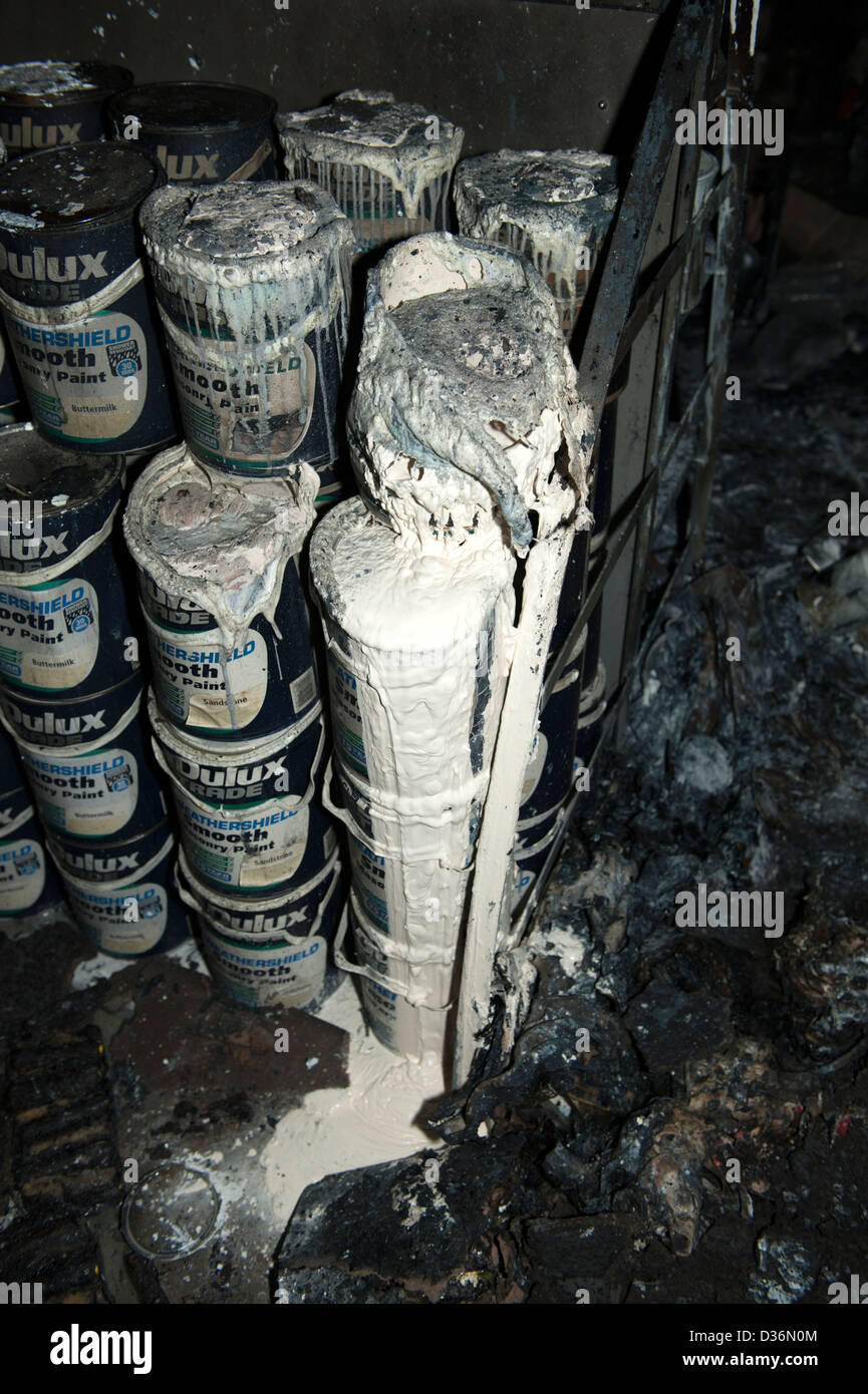 Paint factory fire melted tins of paint Stock Photo - Alamy