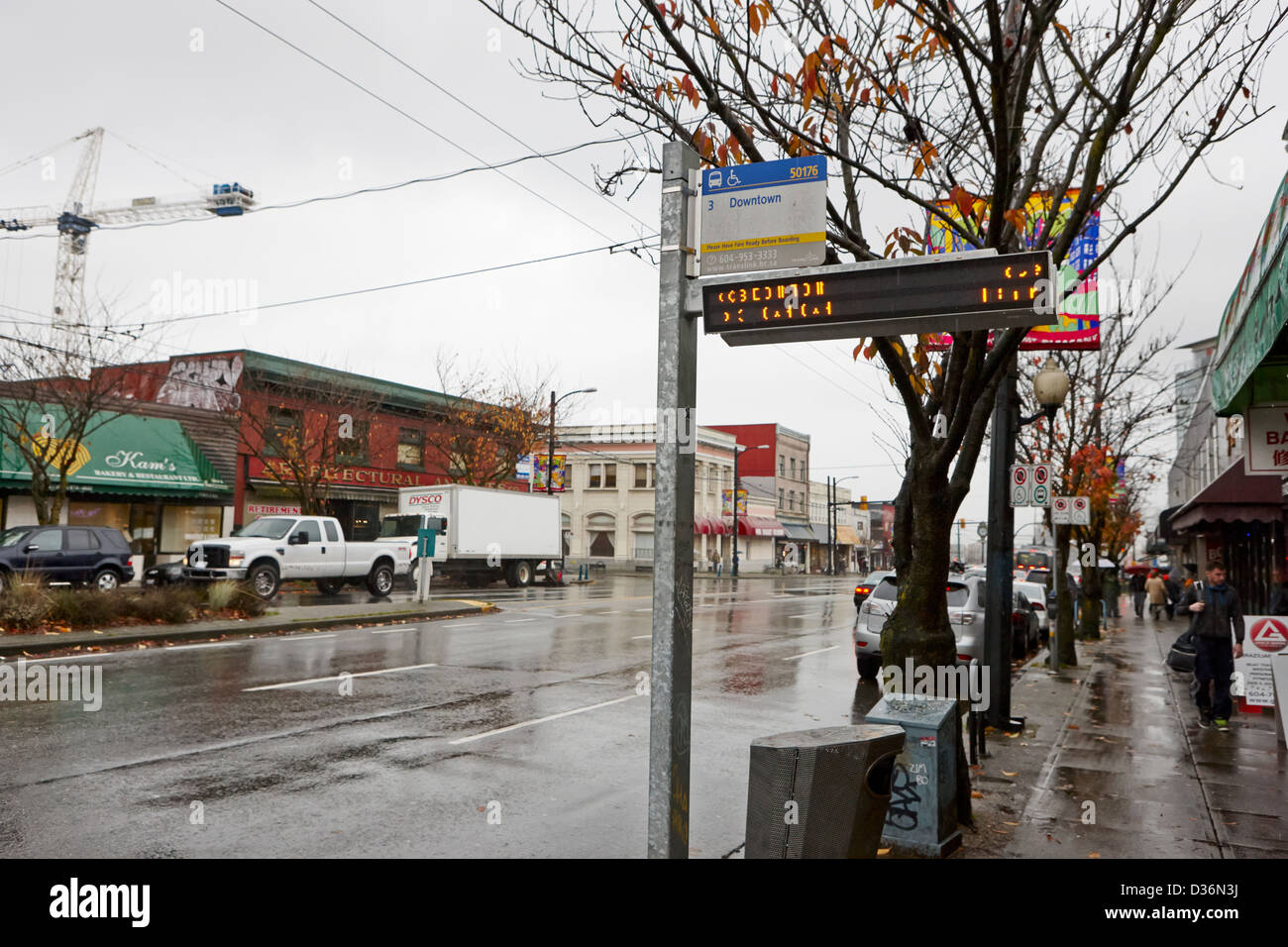 bus stop on main street heading downtown from mount pleasant on a wet ...