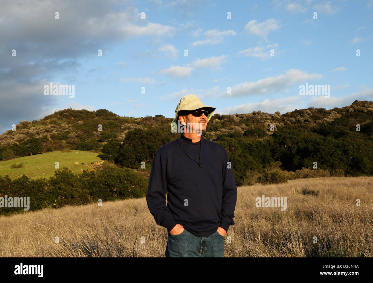 Hiker by meadow at Trippet Ranch in Topanga State Park at sunset Stock ...