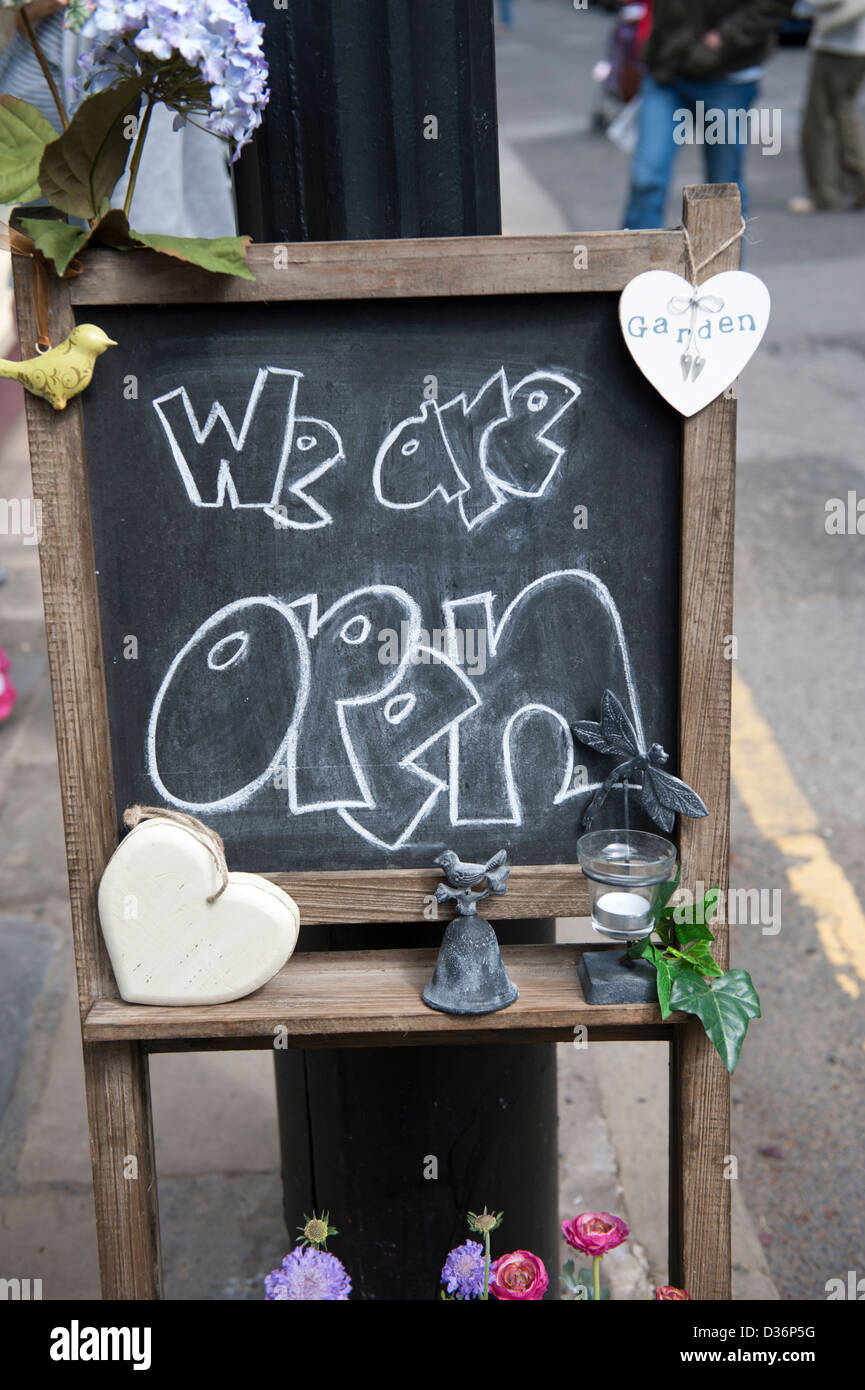 We Are Open sign flowers flowery shop chalk Stock Photo - Alamy