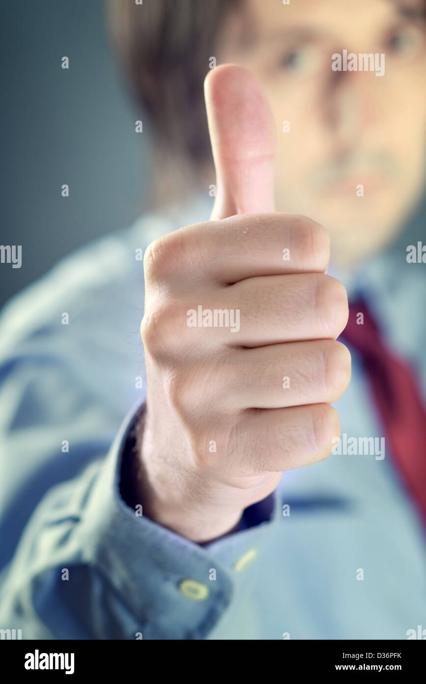 Businessman showing thumb up, satisfied pleased employer or manager ...