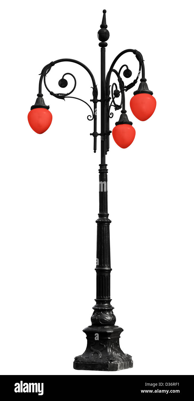 Vintage cast iron lamppost with red light isolated on white background ...