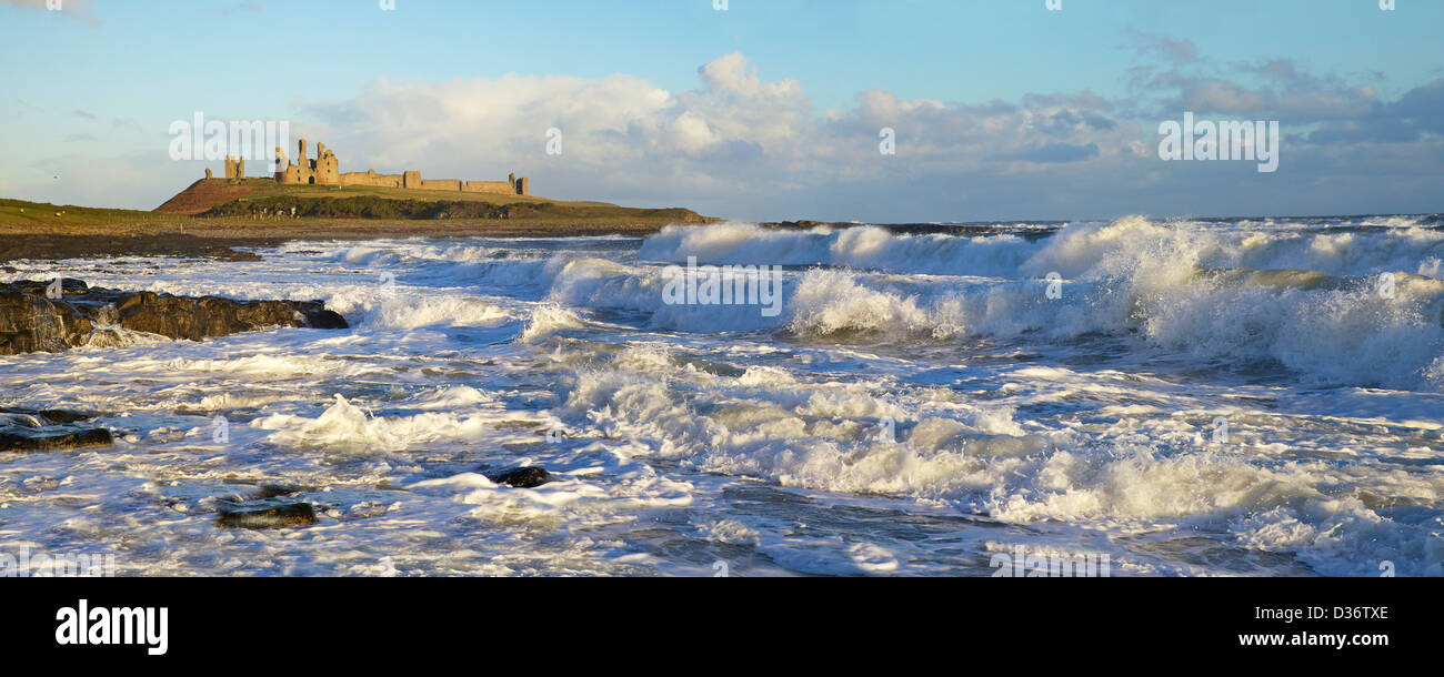 Panoramic photo of surf on rocks, Dunstanburgh Castle, Northumberland ...
