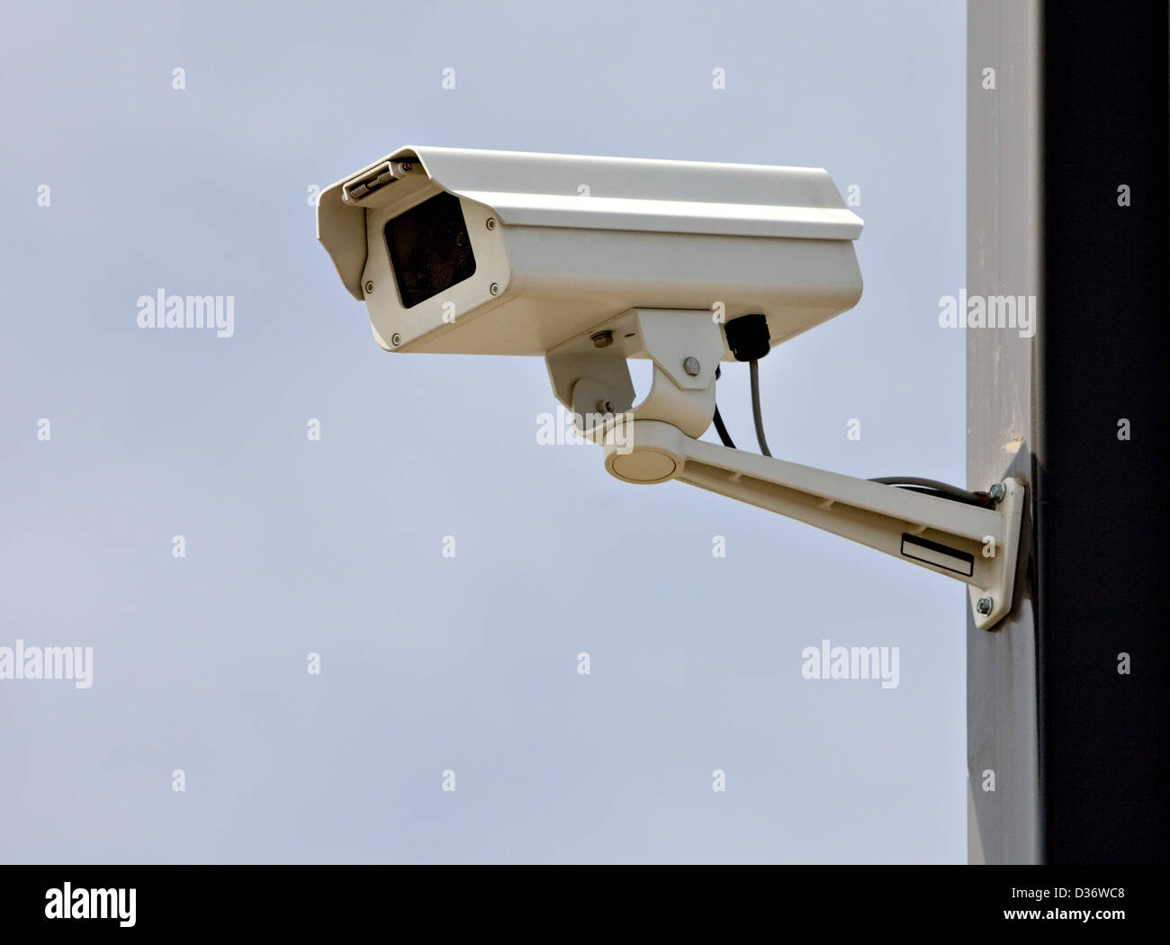 CCTV security camaera on pole watching the area Stock Photo - Alamy