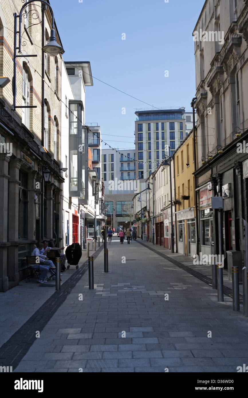 A view along Caroline street in the city centre of Cardiff Wales, with ...