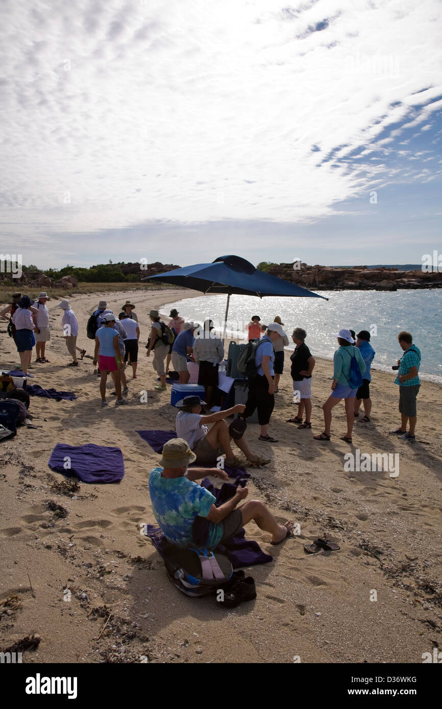 Orion passengers gather on the beach on Jar Island, Vansittart Bay, in ...