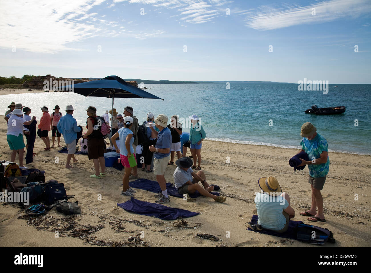 Orion passengers gather on the beach on Jar Island, Vansittart Bay, in ...