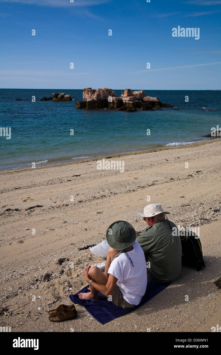 Orion passengers gather on the beach on Jar Island, Vansittart Bay, in ...