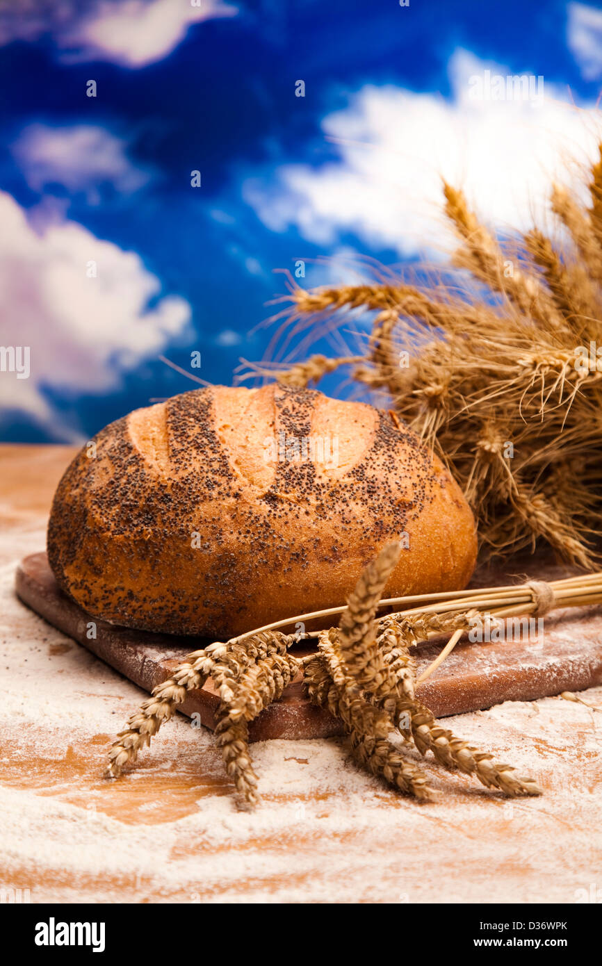 Assortment of baked bread on blue sky background Stock Photo - Alamy