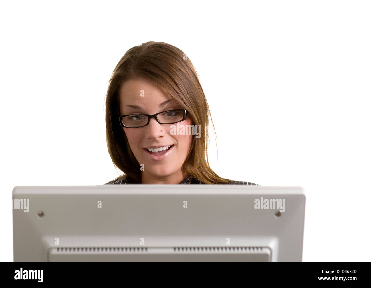 A young office working laughing at her email Stock Photo - Alamy