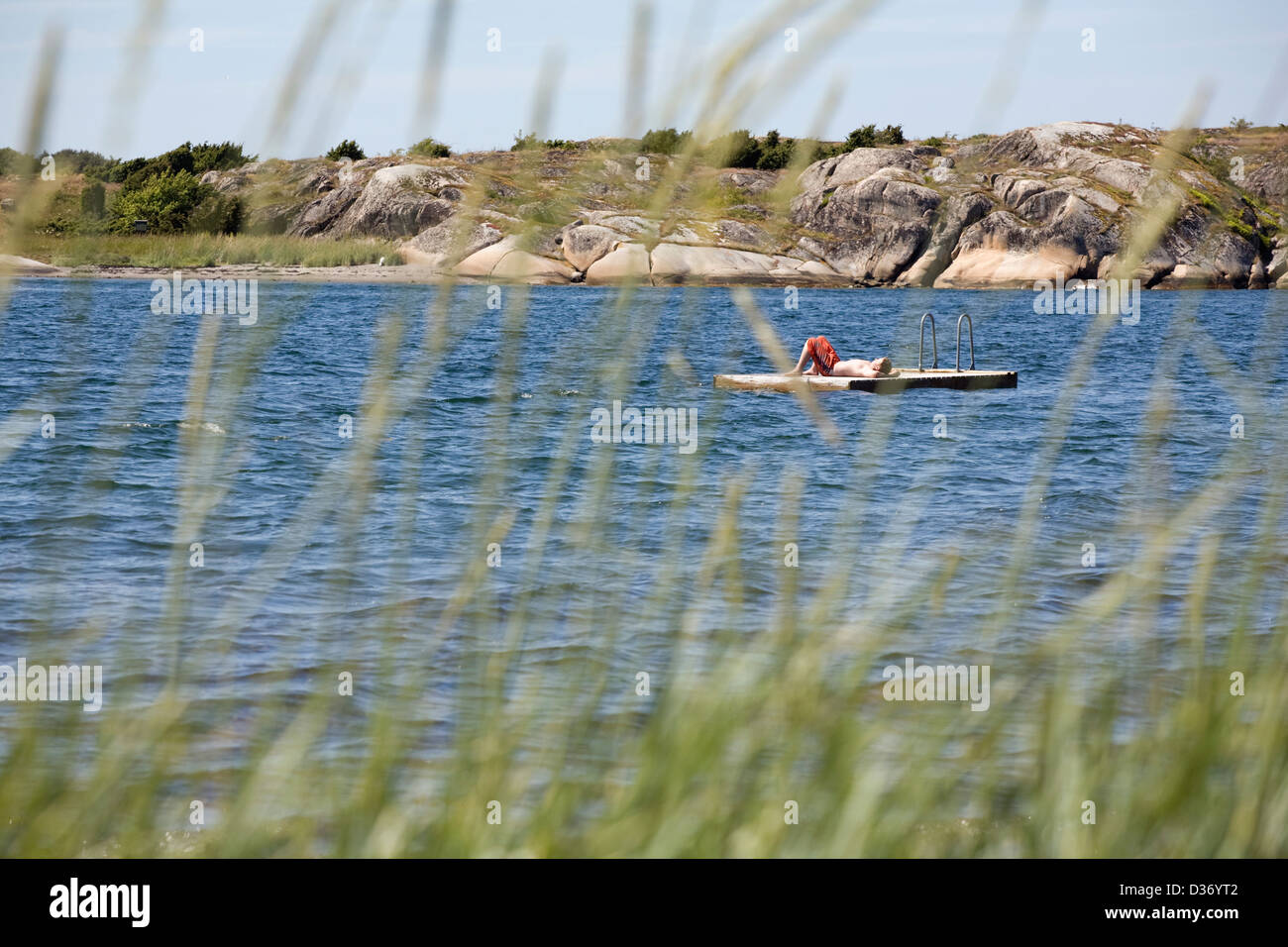 Grebbestad, Sweden, boy on a floating pontoon on Tanumstrand Stock ...