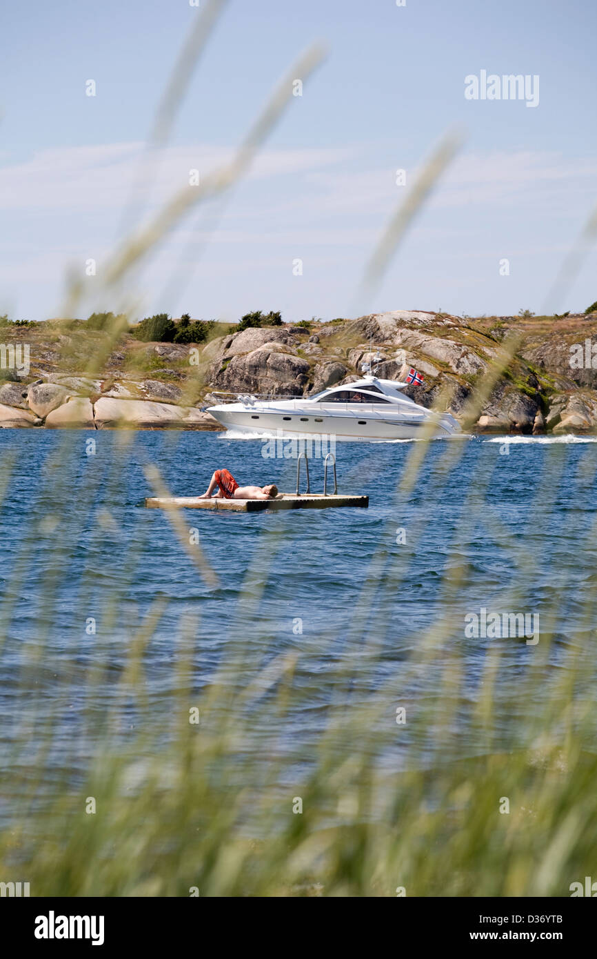 Grebbestad, Sweden, boy on a floating pontoon on Tanumstrand Stock ...