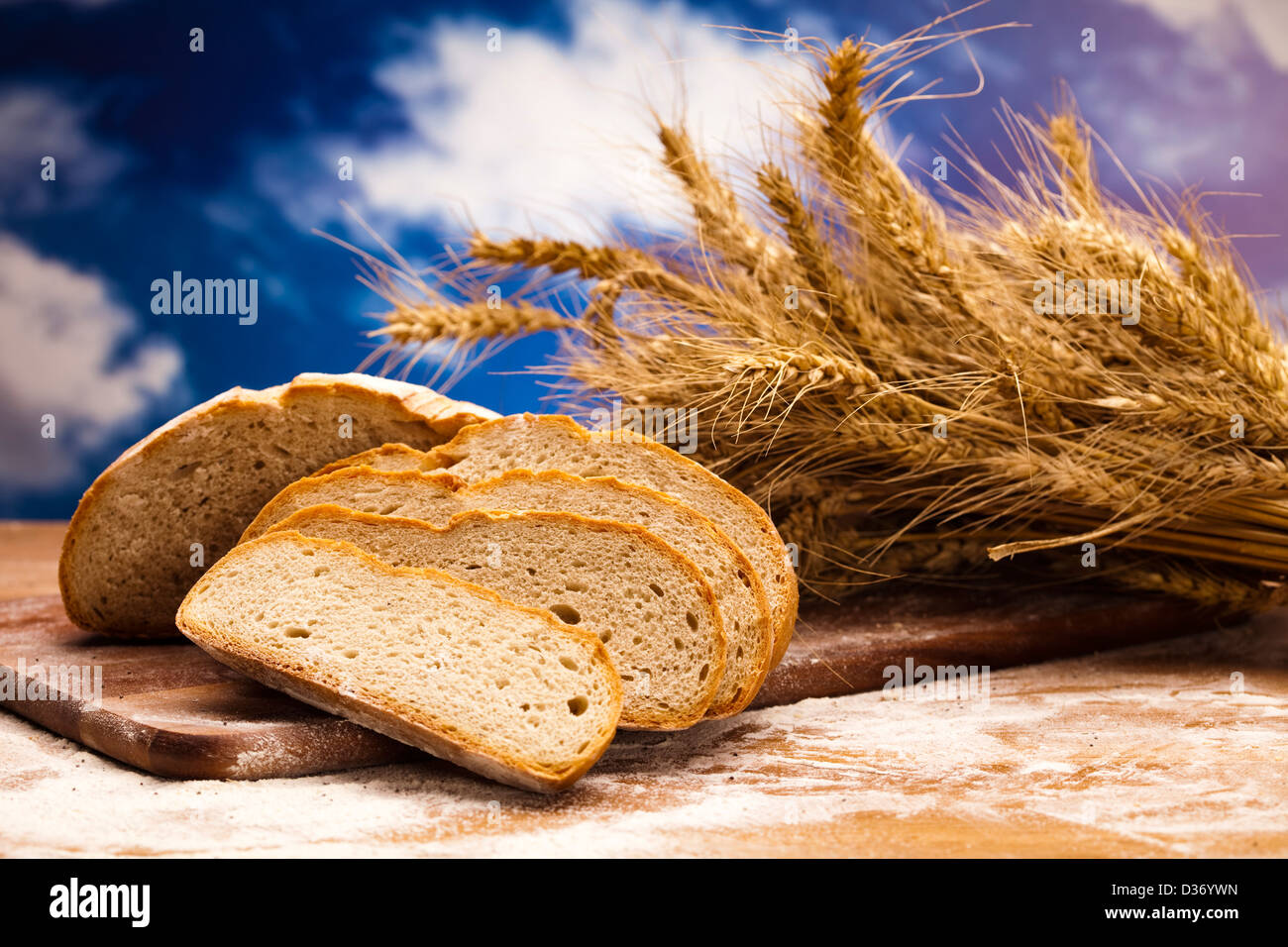 Assortment of baked bread on blue sky background Stock Photo - Alamy