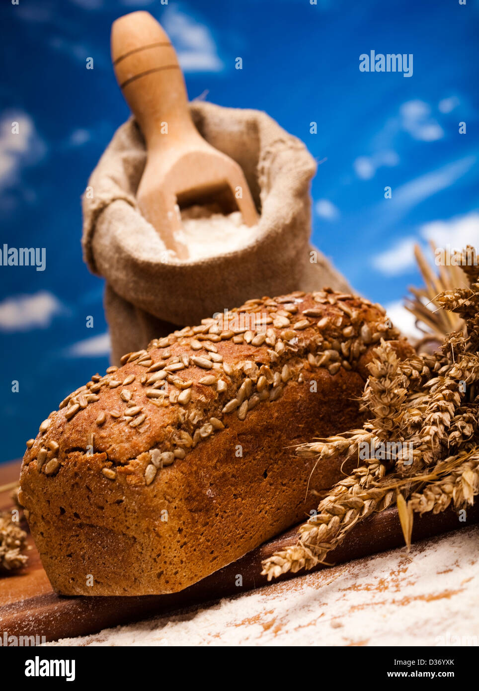 Assortment of baked bread on blue sky background Stock Photo - Alamy