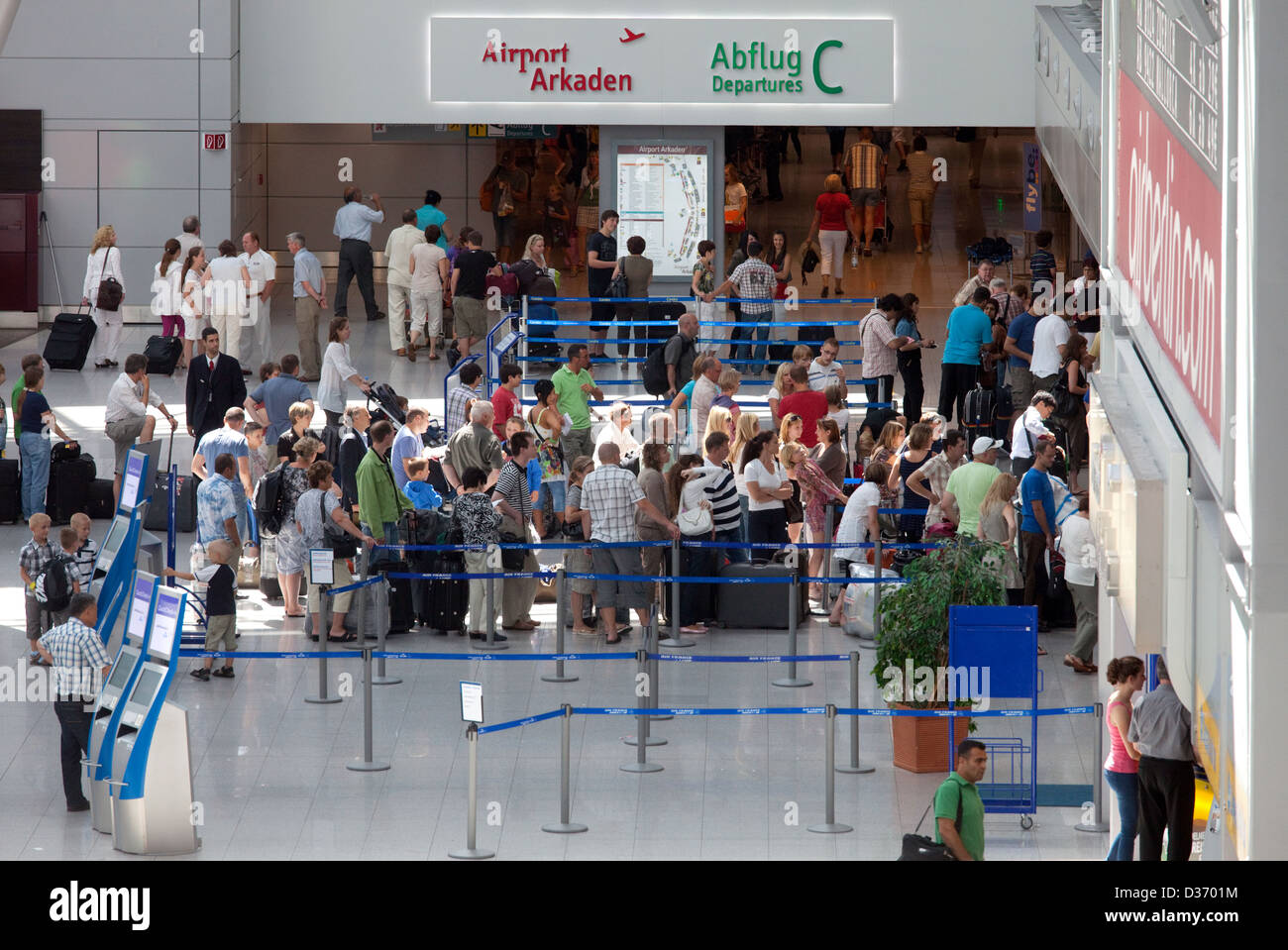Duesseldorf, Germany, passengers standing in a queue at check-in Stock ...