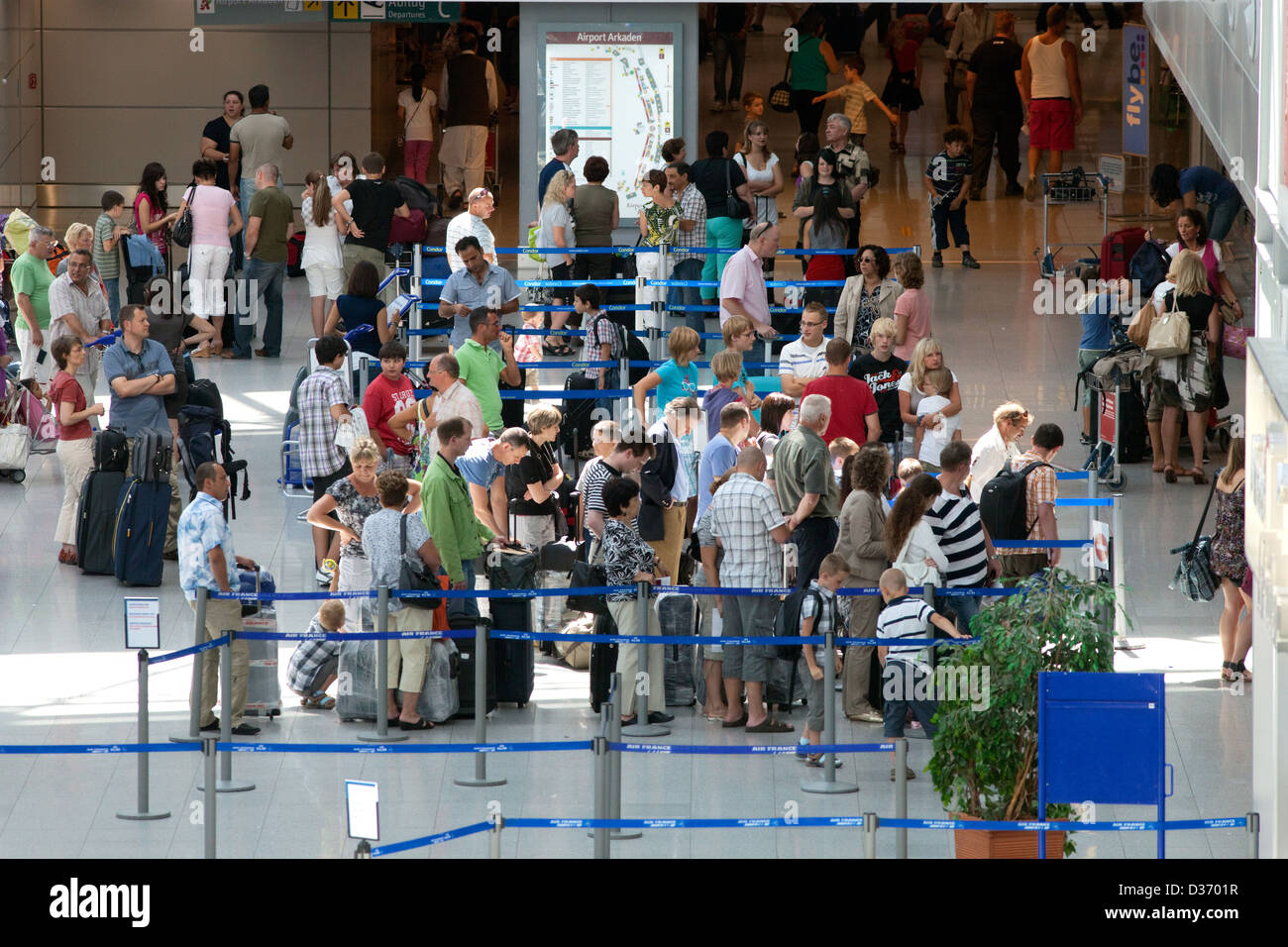 Duesseldorf, Germany, passengers standing in a queue at check-in Stock ...