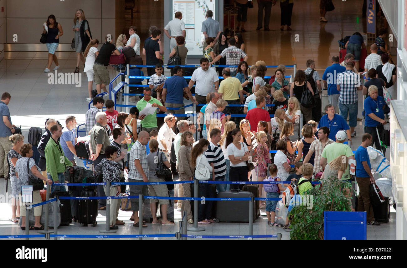 Duesseldorf, Germany, passengers standing in a queue at check-in Stock ...