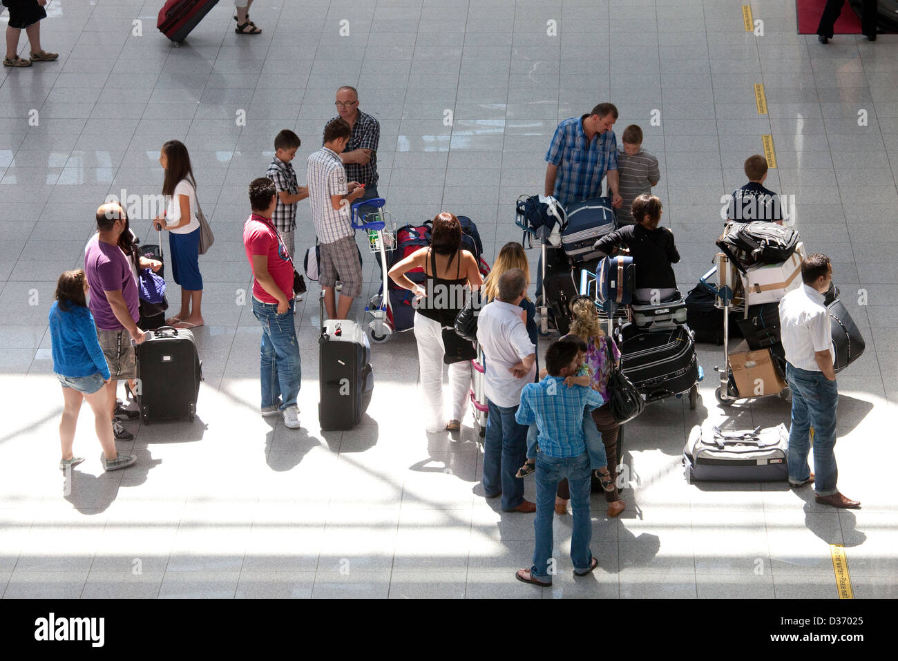 Duesseldorf, Germany, passengers standing in a queue at check-in Stock ...