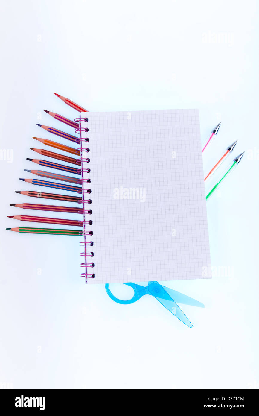 Back to school, Notepad with supplies and scissors Stock Photo - Alamy