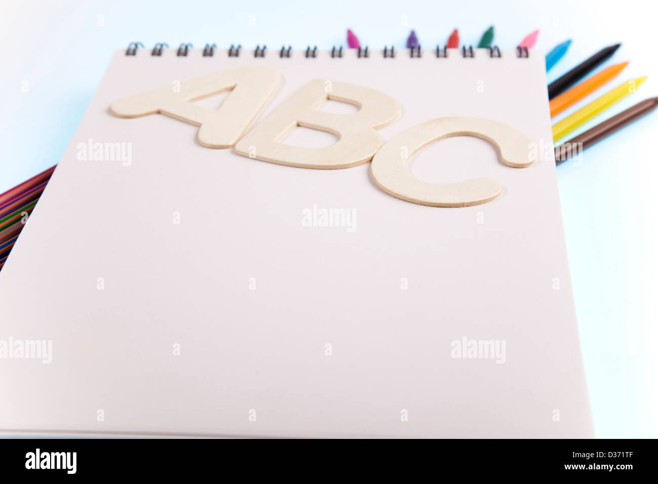 Notebook, Alphabet and school supplies Stock Photo - Alamy