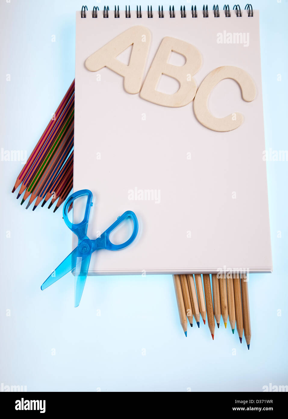 Notebook, Alphabet and school supplies Stock Photo - Alamy