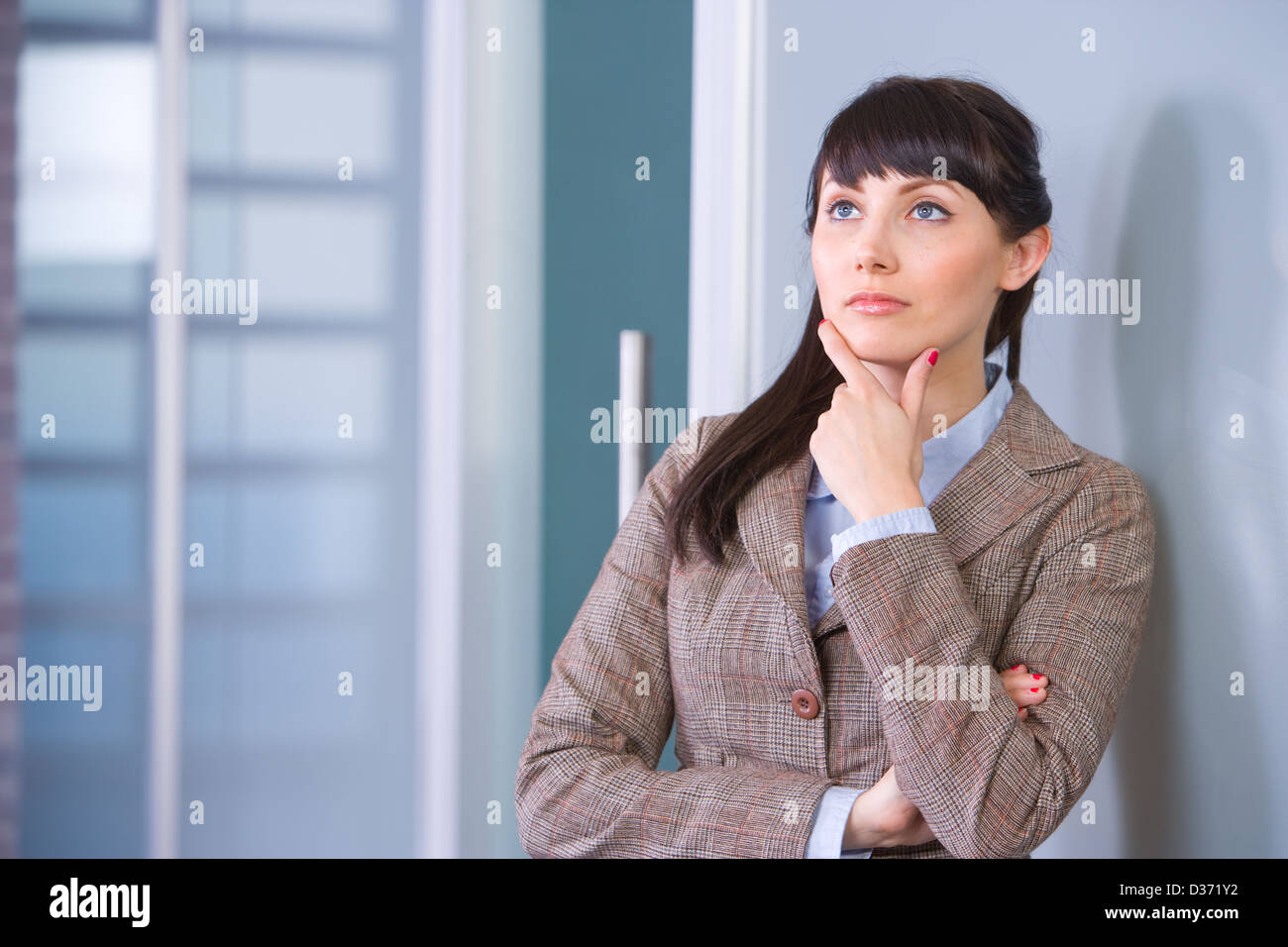 Business Woman Thinking in a Modern Office Stock Photo - Alamy