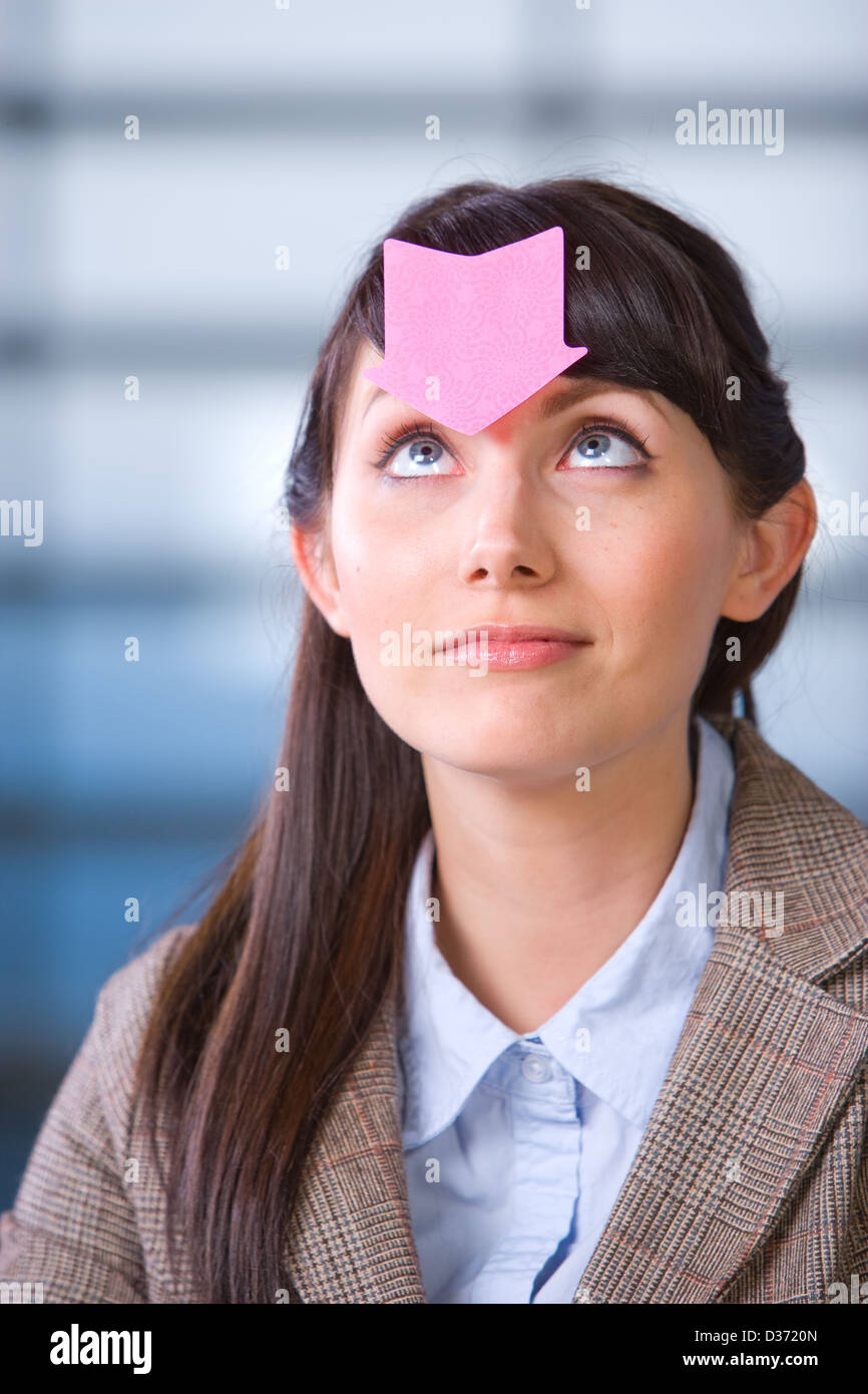 Business Woman post it on head in modern office Stock Photo - Alamy