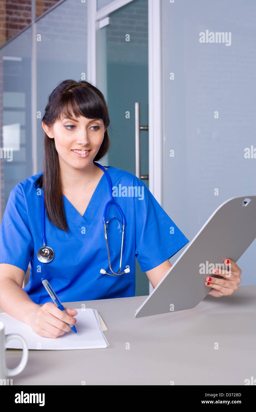 Woman Nurse with chart in modern hospital Stock Photo - Alamy