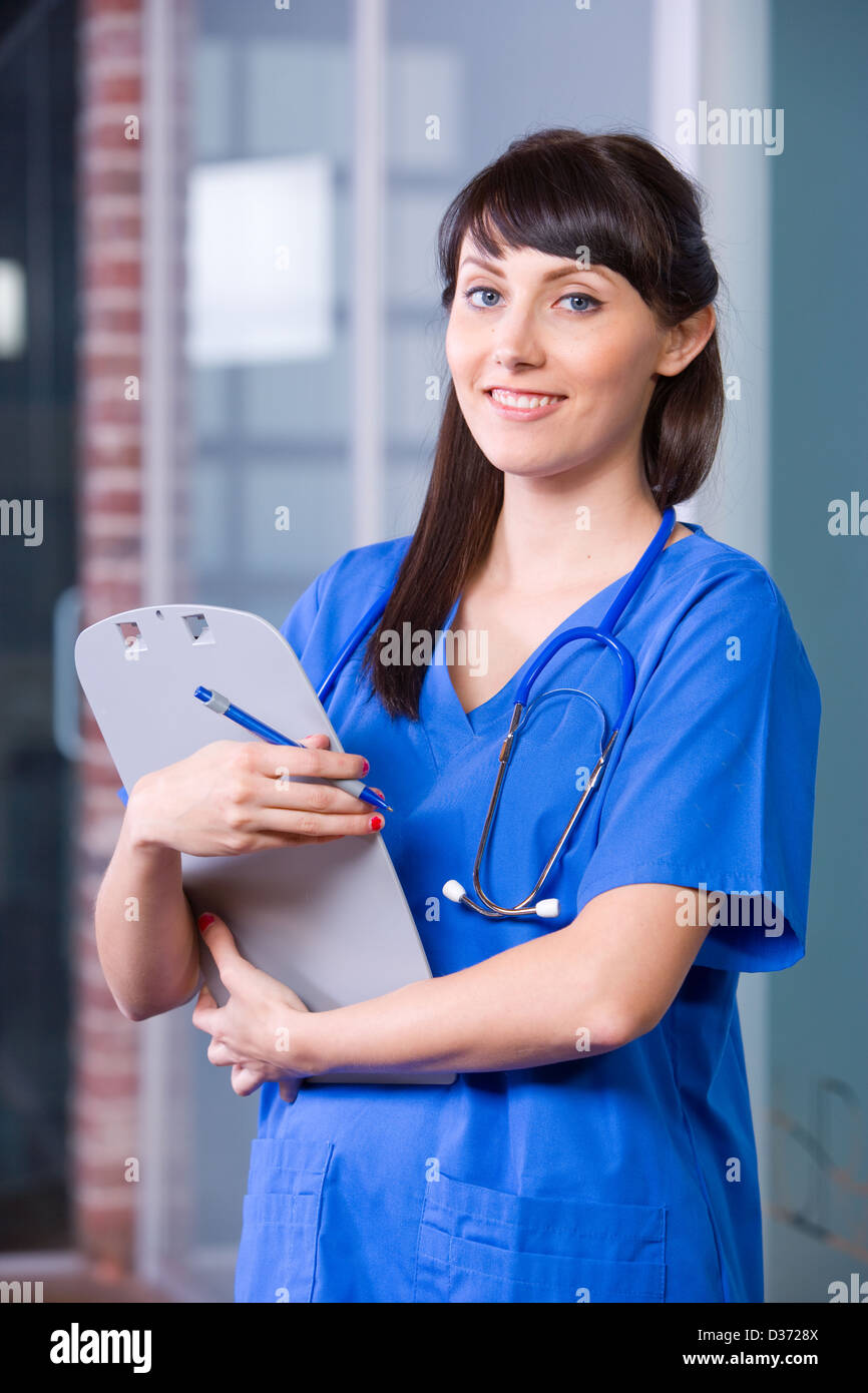 Woman Nurse with chart in modern hospital Stock Photo - Alamy