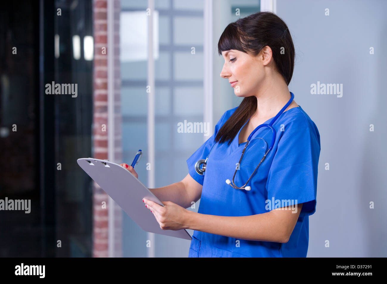 Woman Nurse with chart in modern hospital Stock Photo - Alamy