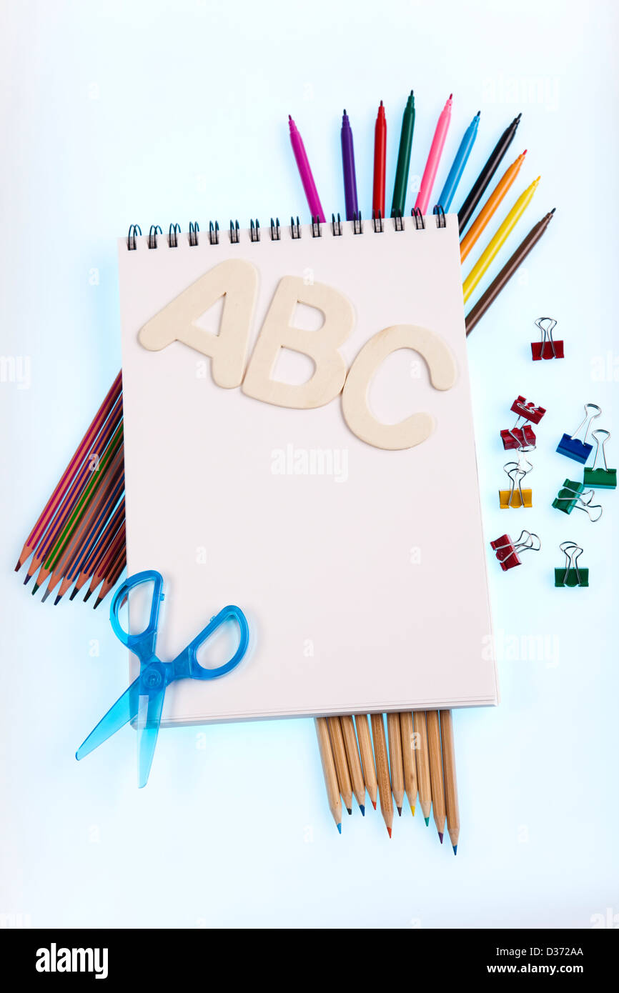 Notebook, Alphabet and school supplies Stock Photo - Alamy