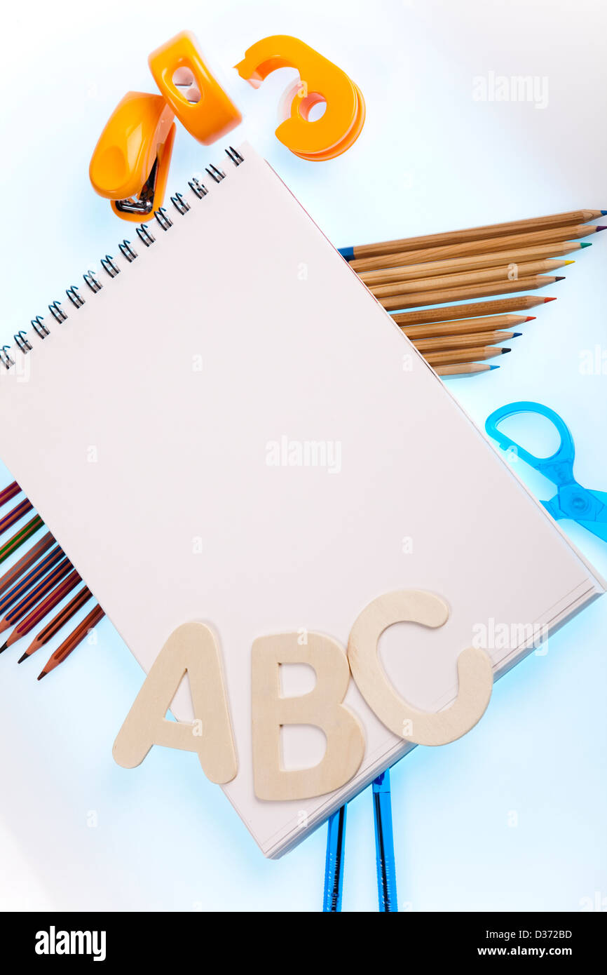 Notebook, Alphabet and school supplies Stock Photo - Alamy