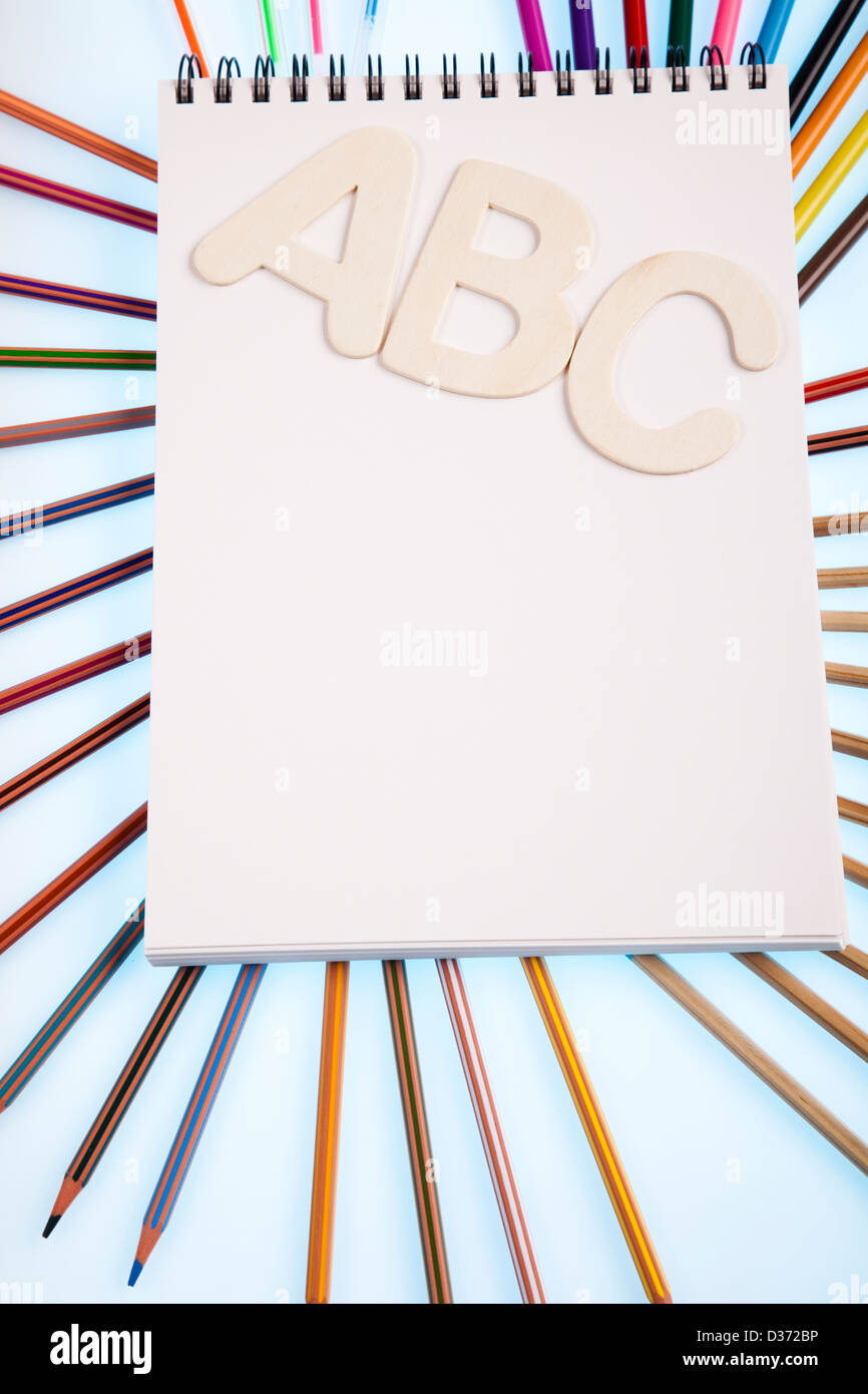 Notebook, Alphabet and school supplies Stock Photo - Alamy