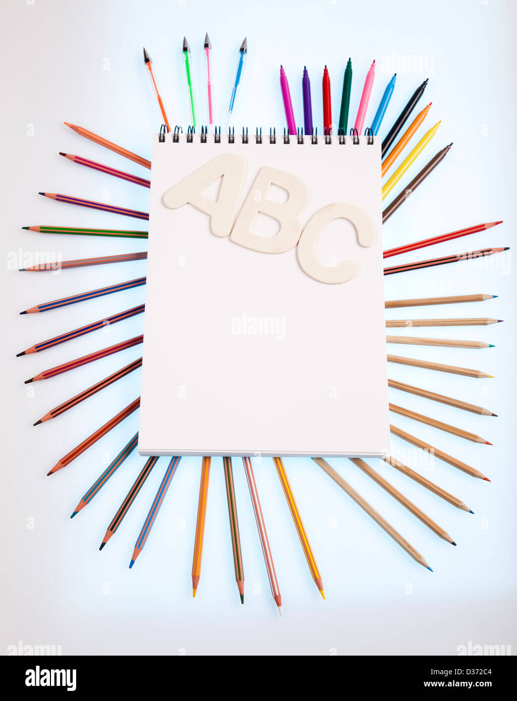 Notebook, Alphabet and school supplies Stock Photo - Alamy