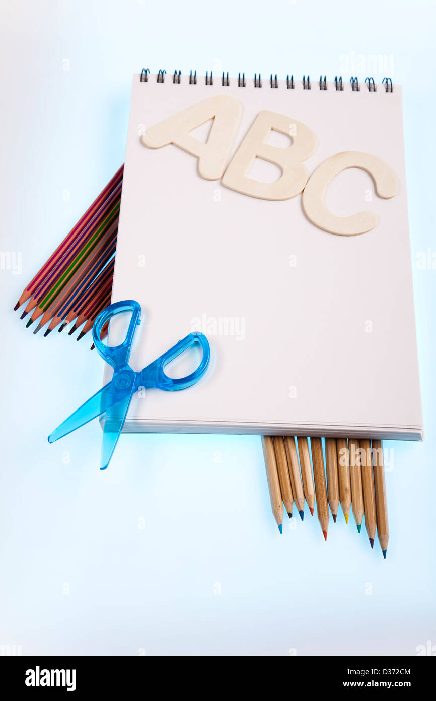 Back to school, Notepad with supplies and scissors Stock Photo - Alamy