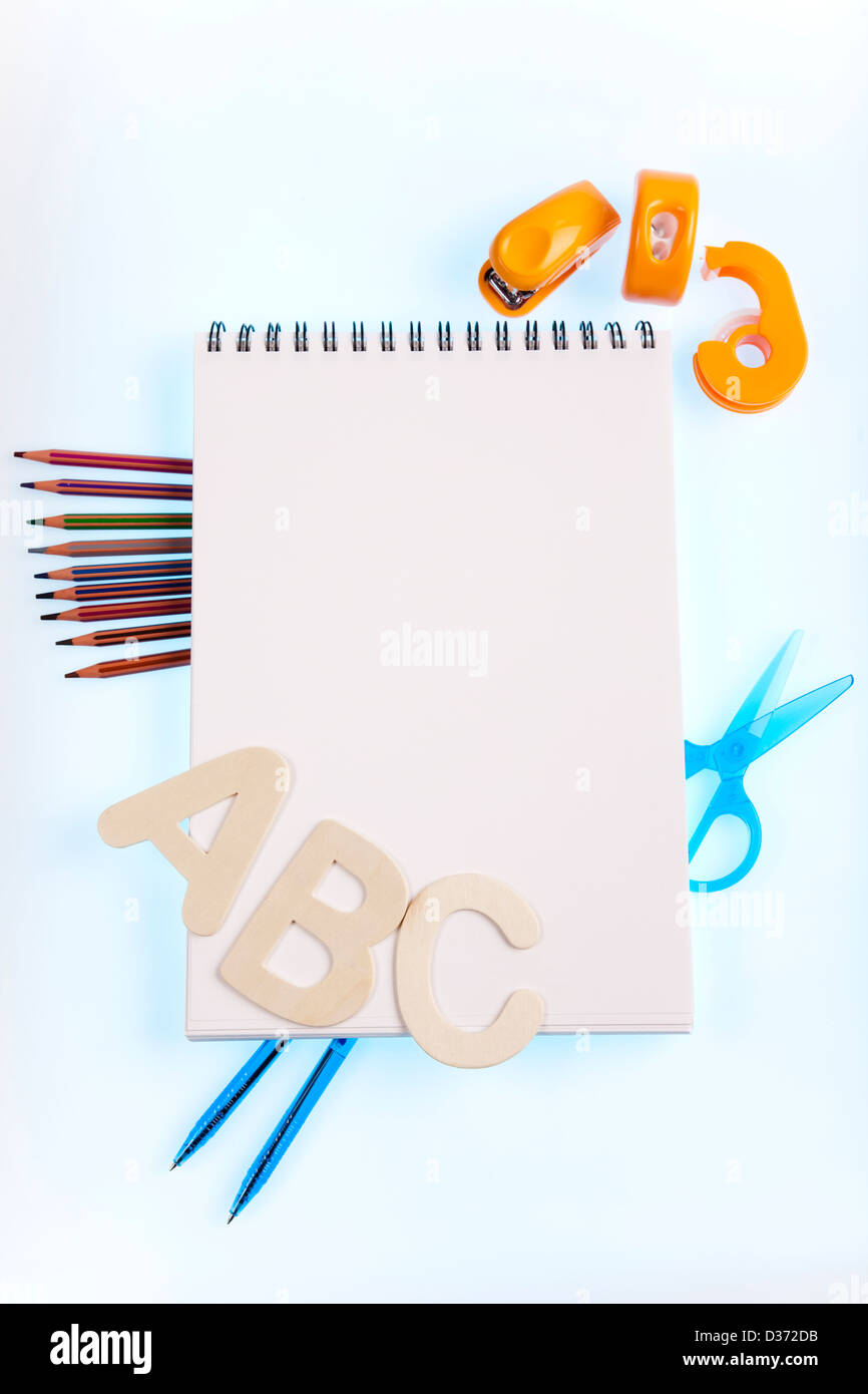 Notebook, Alphabet and school supplies Stock Photo - Alamy